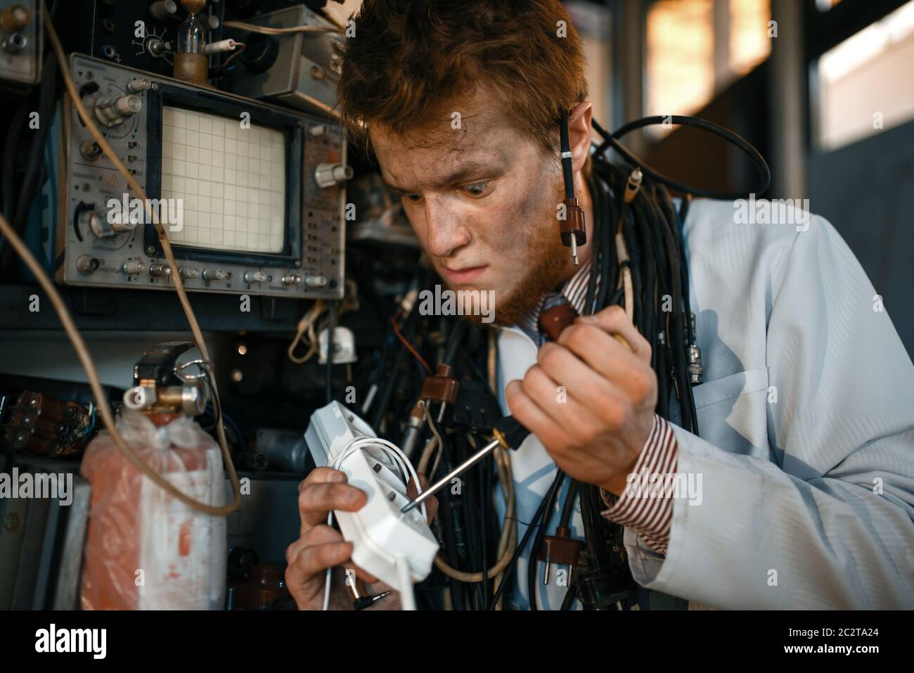 Crazy scientist works with electricity in laboratory. Electrical ...