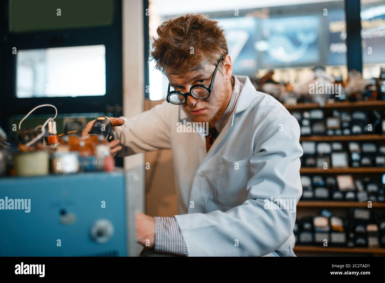 Strange scientist holds screwdriver at his temple, dangerous test in ...