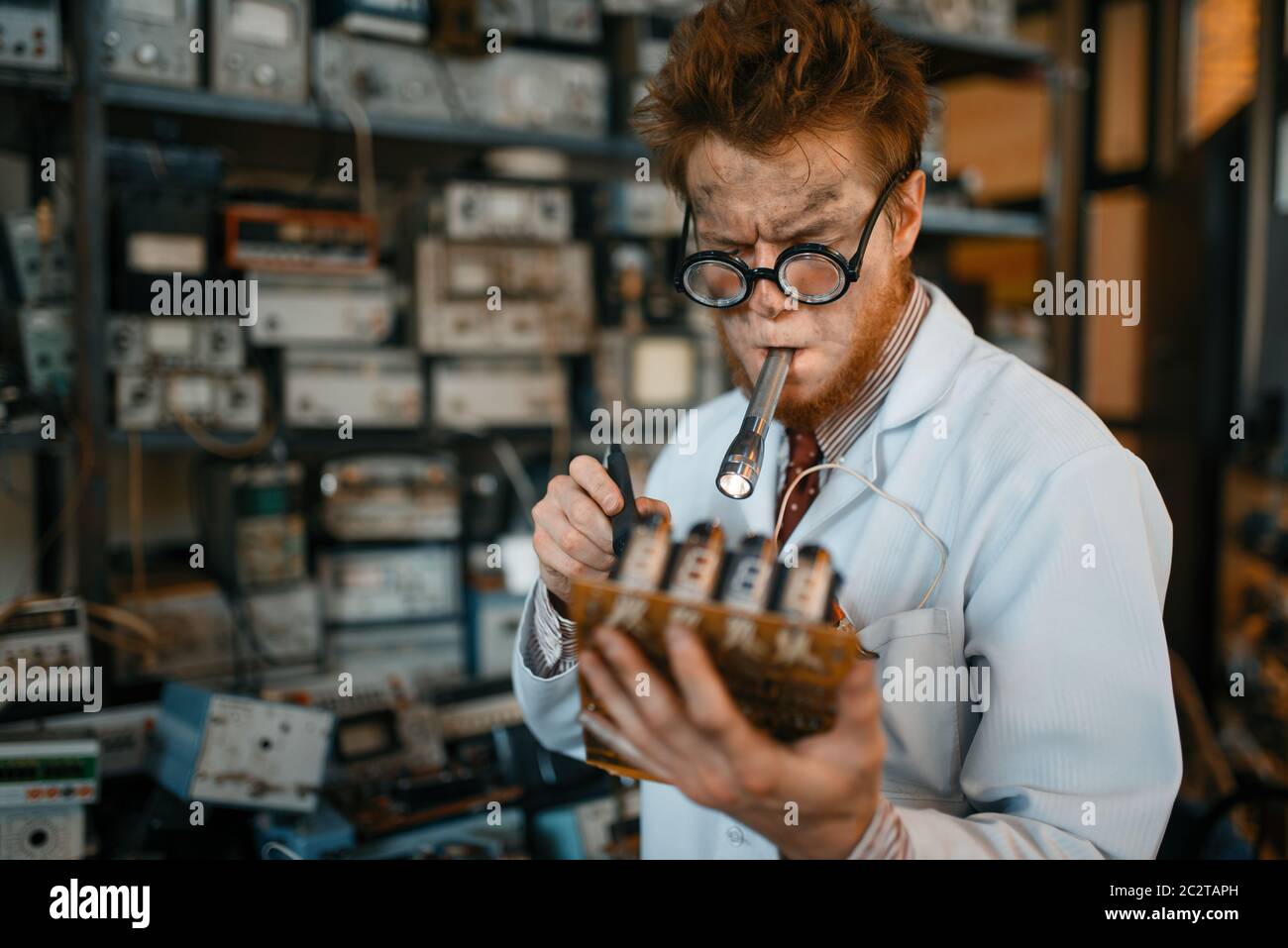 Strange engineer soldering chips, test in laboratory. Electrical ...