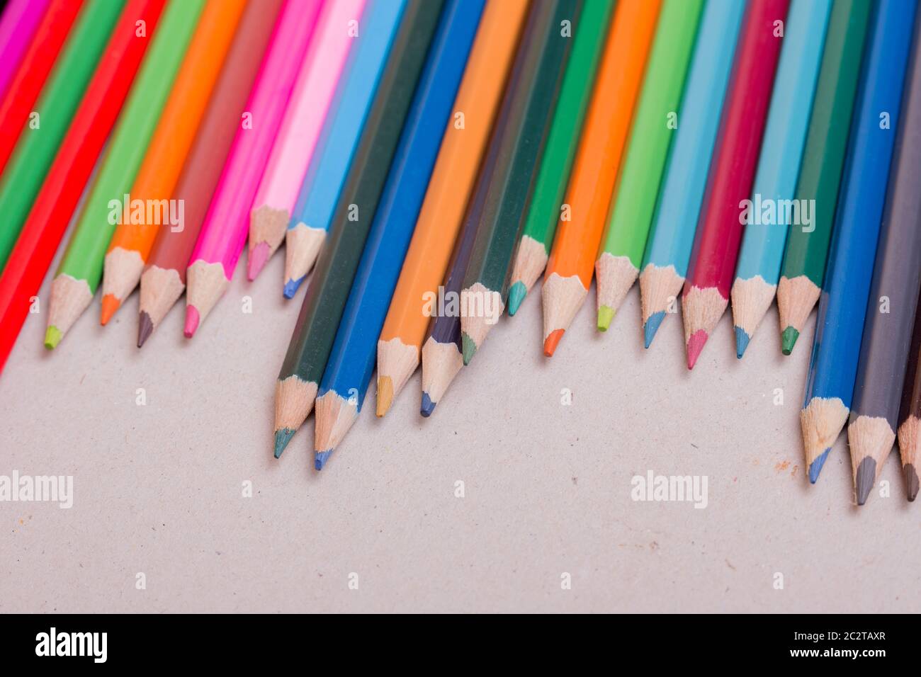 Wooden colorful pencils, on a grey paper Stock Photo - Alamy