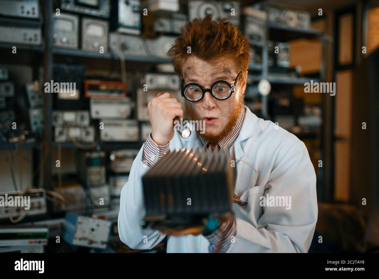 Strange engineer examines the cooling radiator, test in laboratory ...
