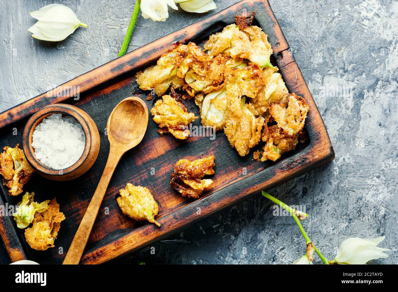 Fried yucca flowers.An unusual dish of edible flowers Stock Photo - Alamy