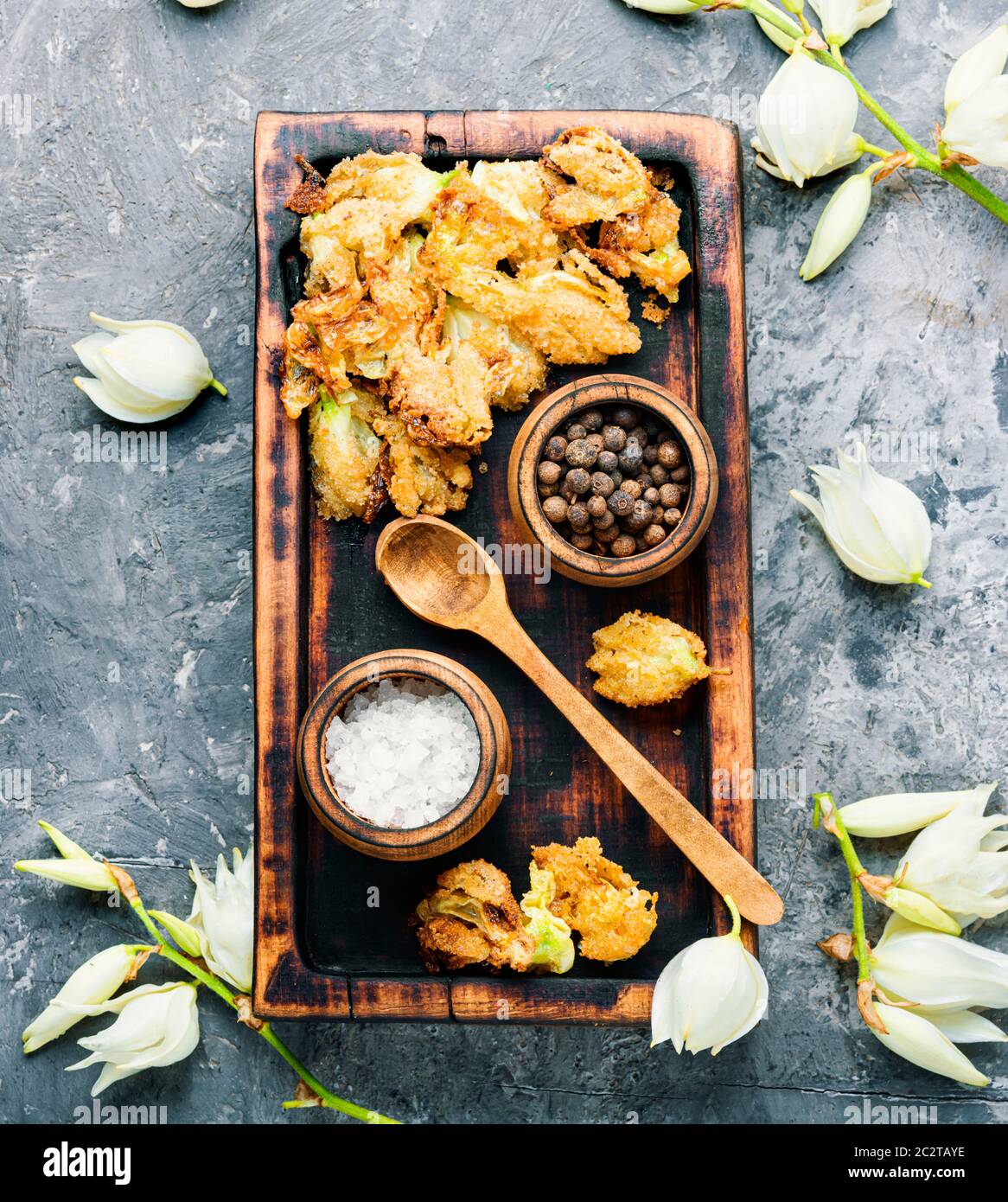 Fried yucca flowers.An unusual dish of edible flowers Stock Photo - Alamy