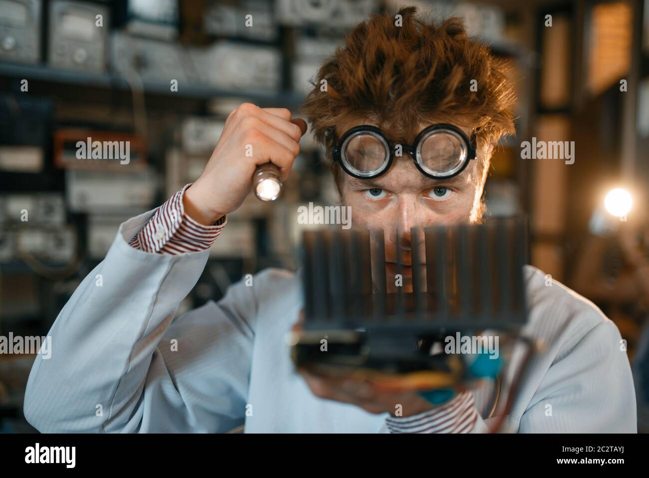 Strange engineer examines the cooling radiator, test in laboratory ...