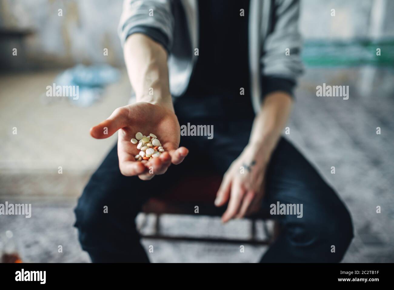 Male junkie reaching out hand with drugs. Addiction concept, addicted ...