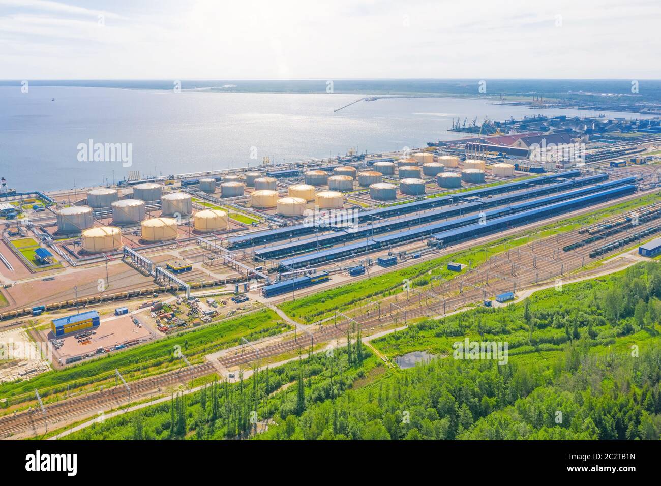 Huge port with oil tanks for storing liquid fuel on the seashore ...