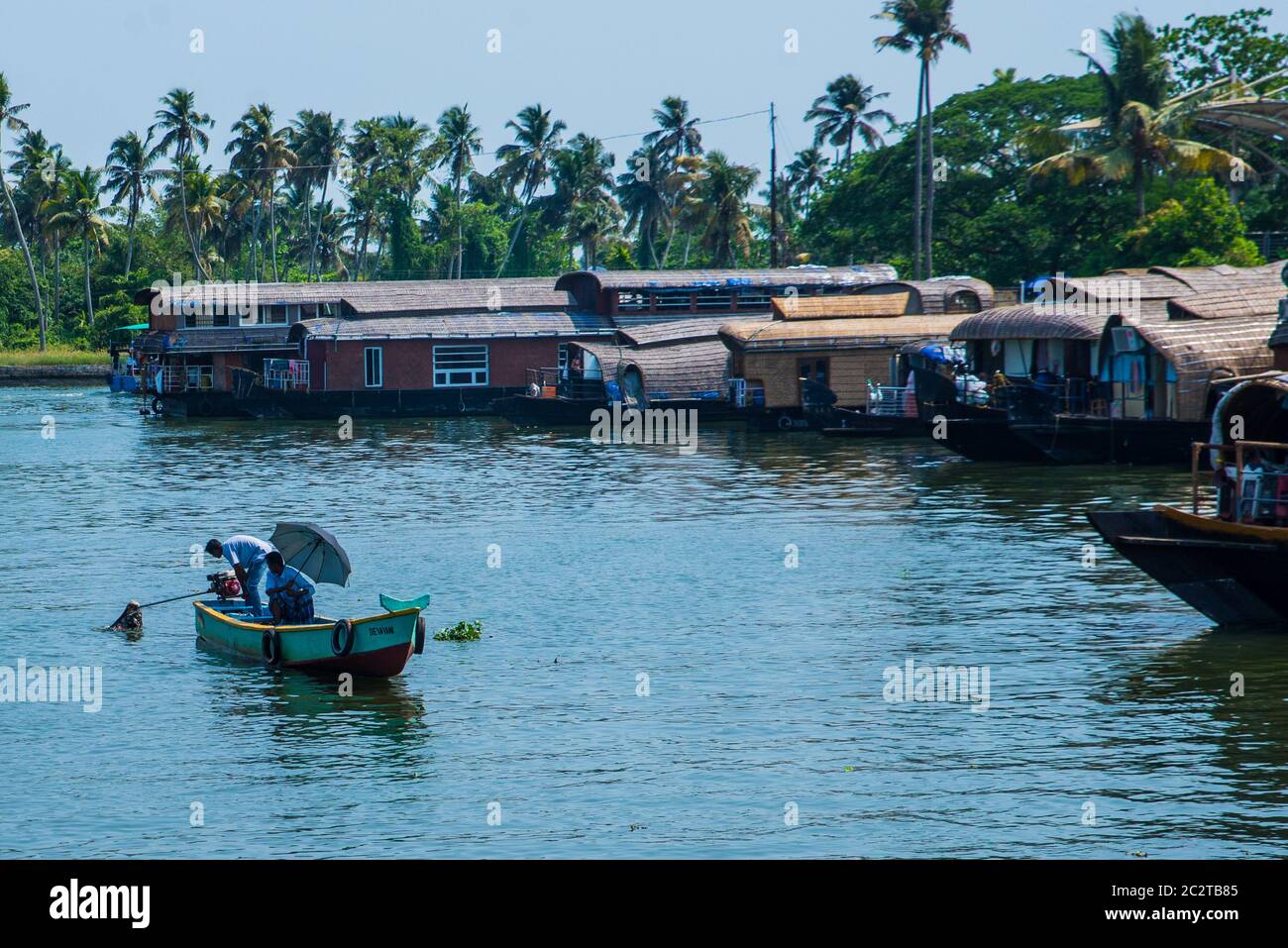 Small houses in a local village located next to Kerala's backwater on a ...