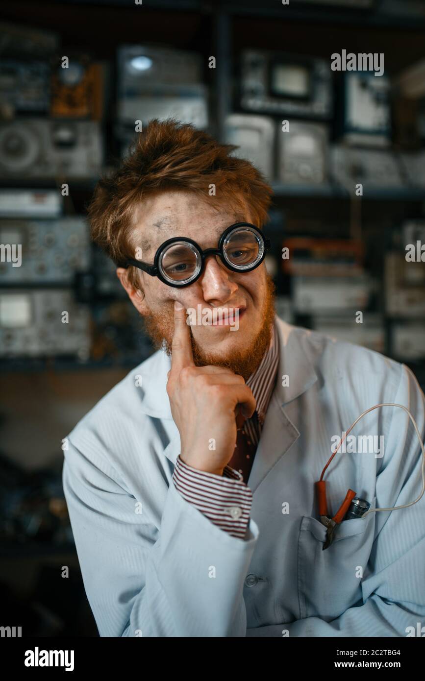 Portrait of strange male scientist in glasses, engineer in laboratory ...