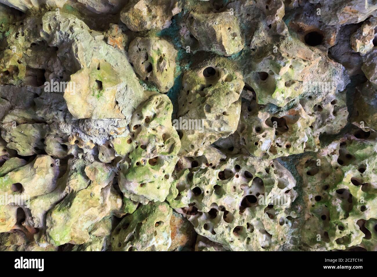 Old rocks with holes texture Stock Photo - Alamy