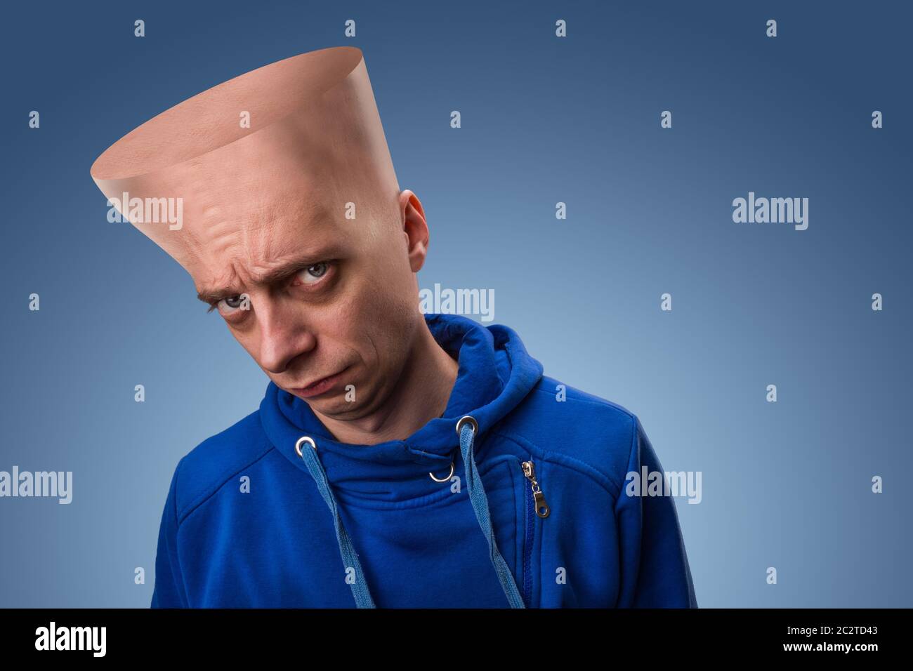 Strange man with a big flat head over blue Stock Photo - Alamy