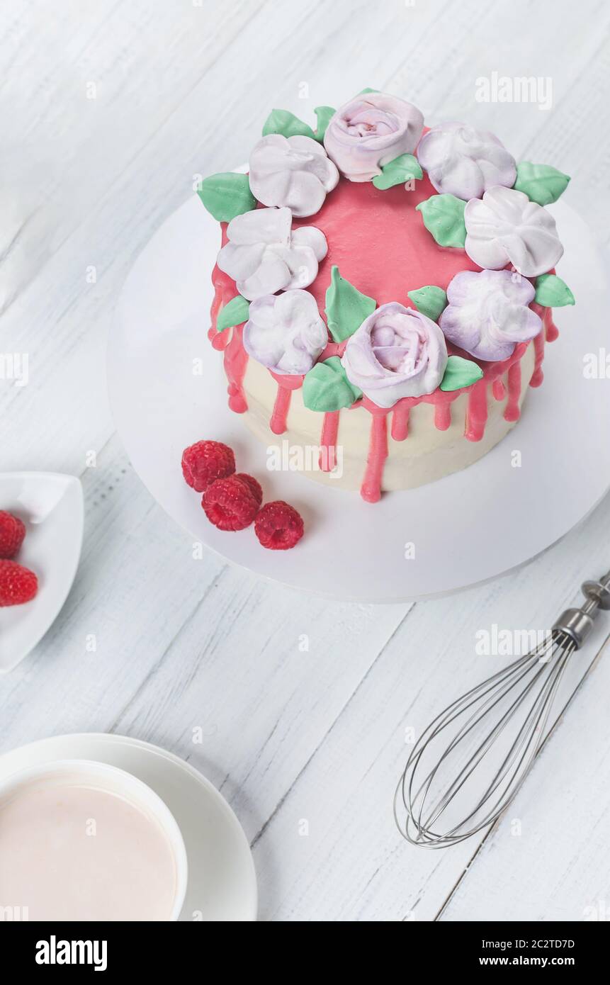Sweet party decorated cake with raspberry for wedding Stock Photo - Alamy