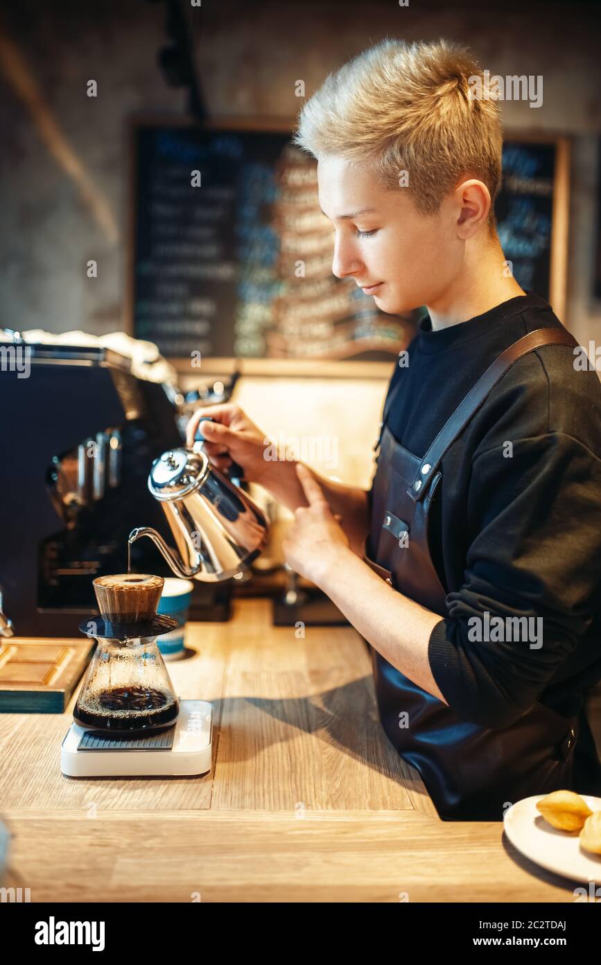 Male waiter pouring water hi-res stock photography and images - Alamy