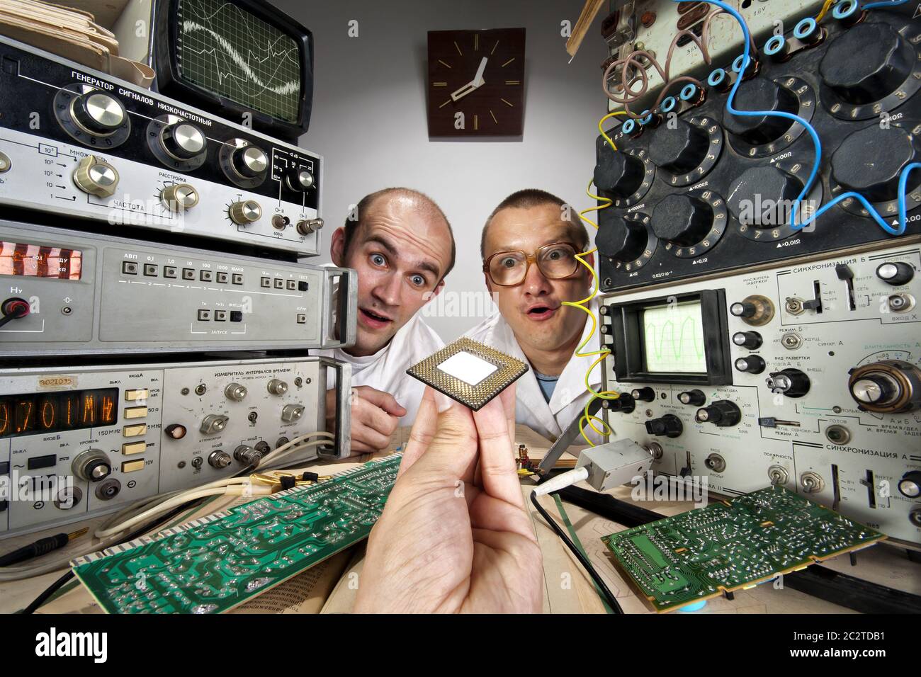 Two funny nerd scientists at vintage technological laboratory looking ...