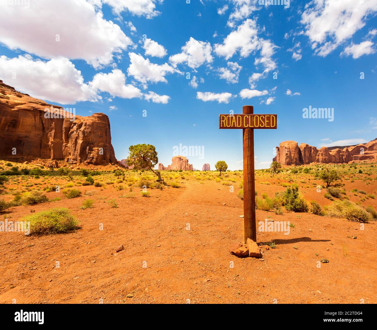 Road closed sign in monuments valley. Desert valley and rocky mountains ...