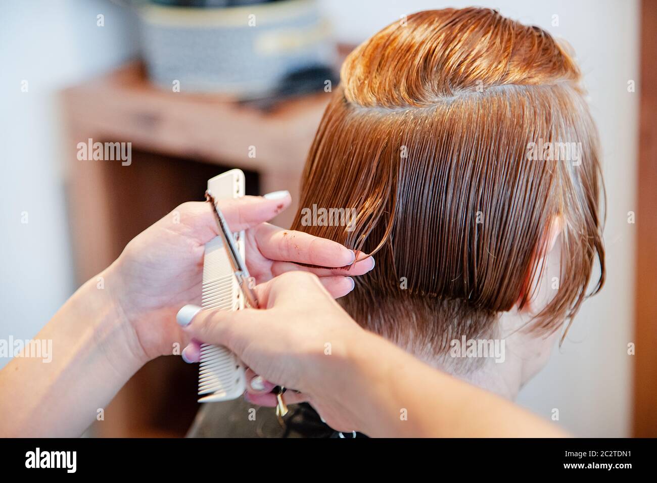 Close up of a masculine hand cutting hair with scissors Stock Photo - Alamy