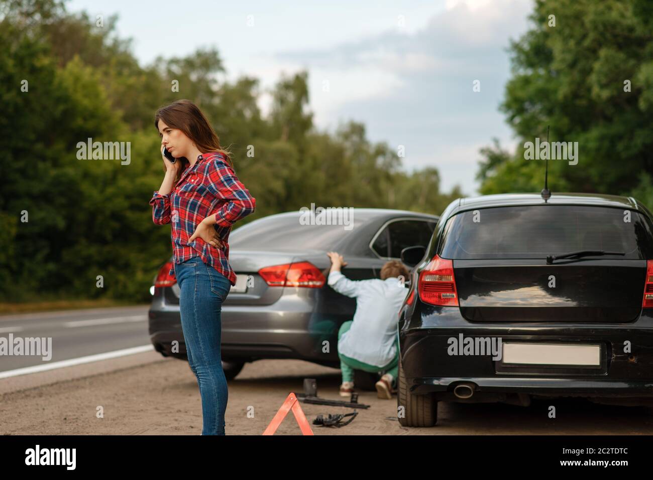Male and female drivers on road, car accident. Automobile crash. Broken ...