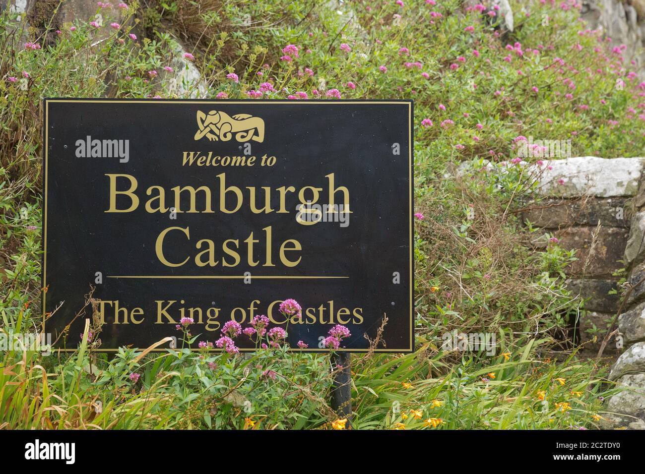 Welcome sign of Bamburgh Castle in Northumberland, England, UK Stock ...