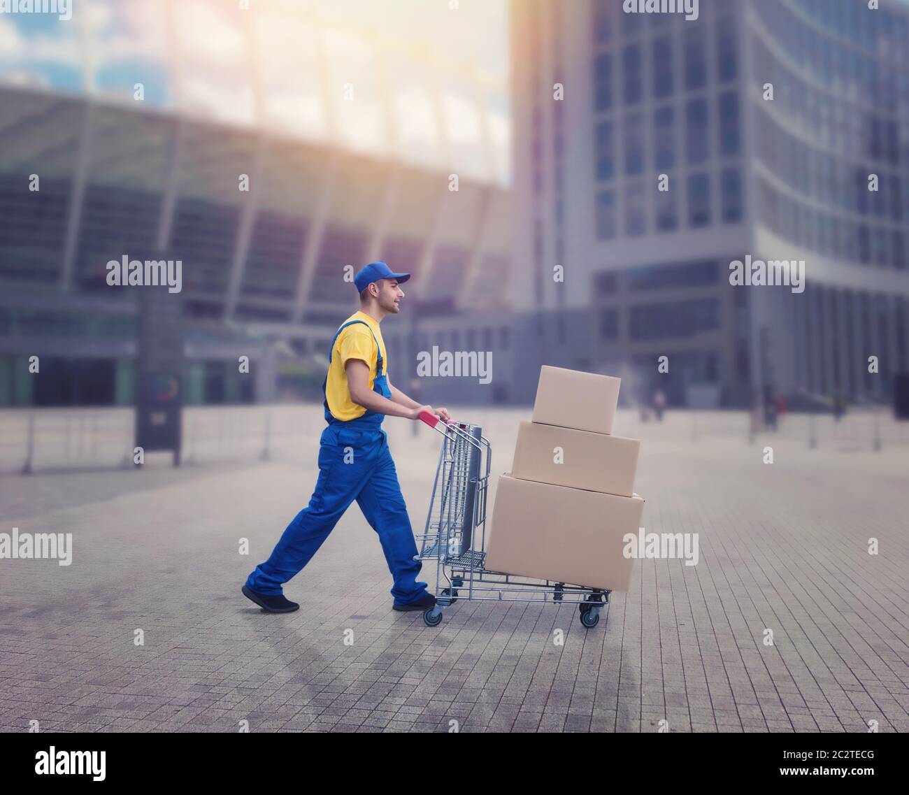 Male courier with trolley in city. Distribution business. Cargo ...