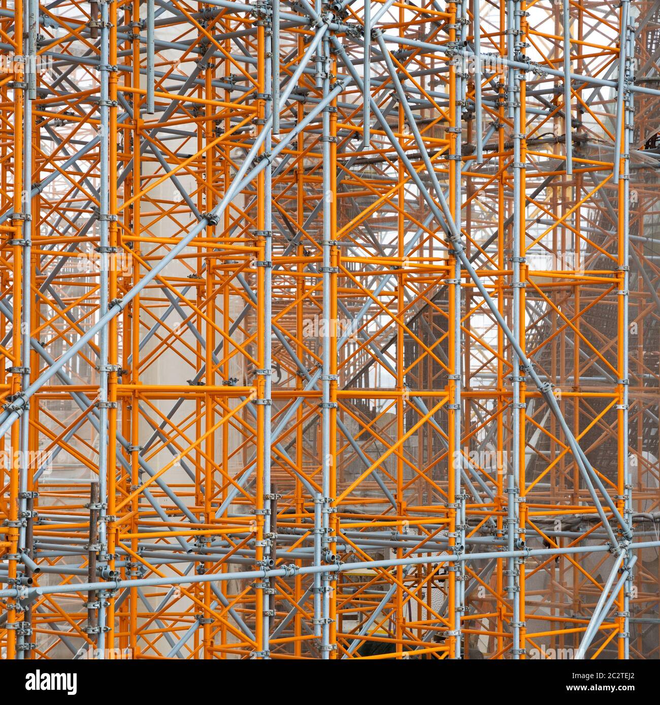 Construction site - scaffolding around new building Stock Photo - Alamy