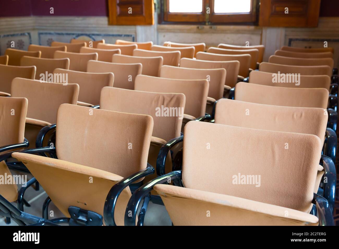 Close up of seats standing in rows in the hall Stock Photo - Alamy