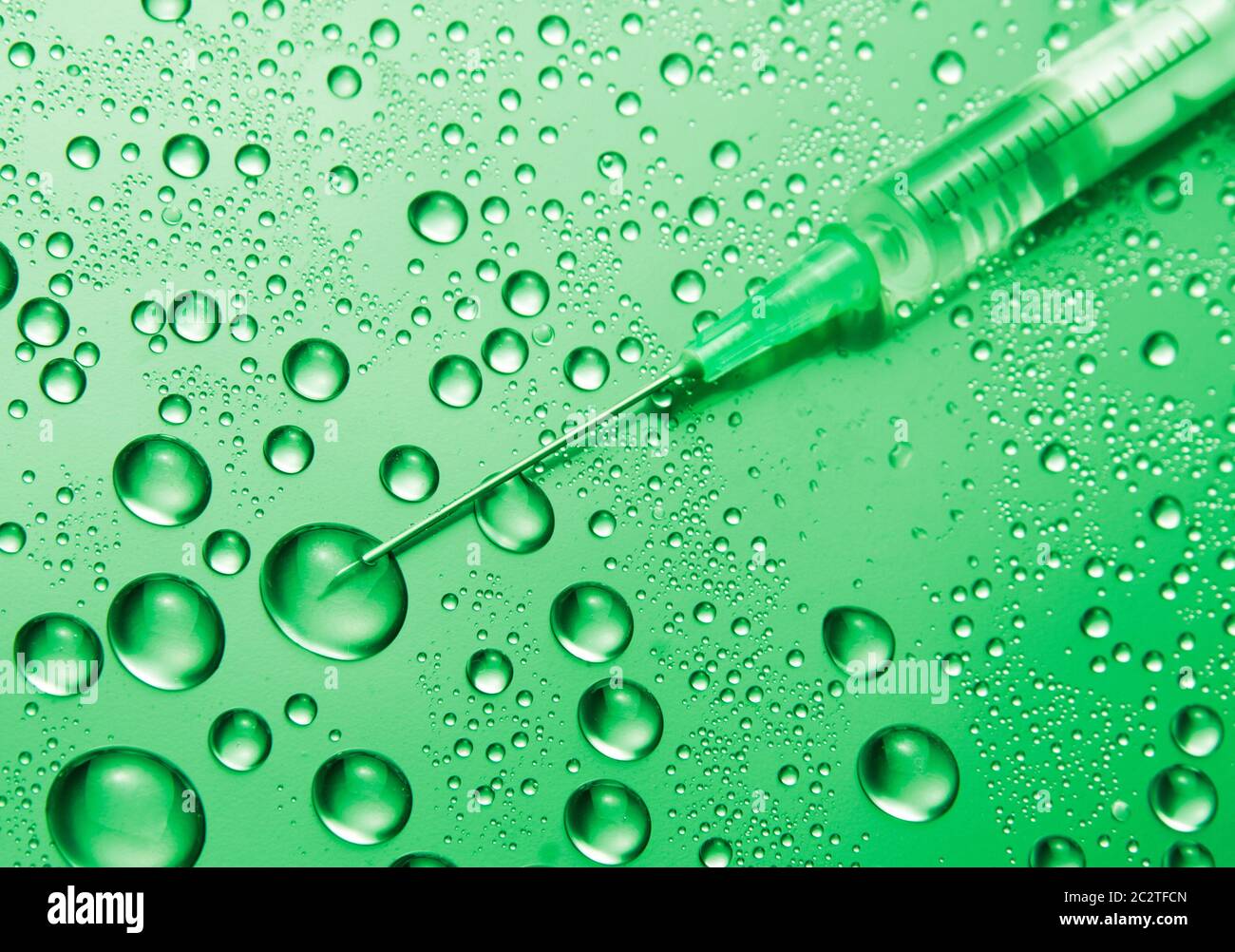 Medical syringe. First aid. Toned in green Stock Photo - Alamy