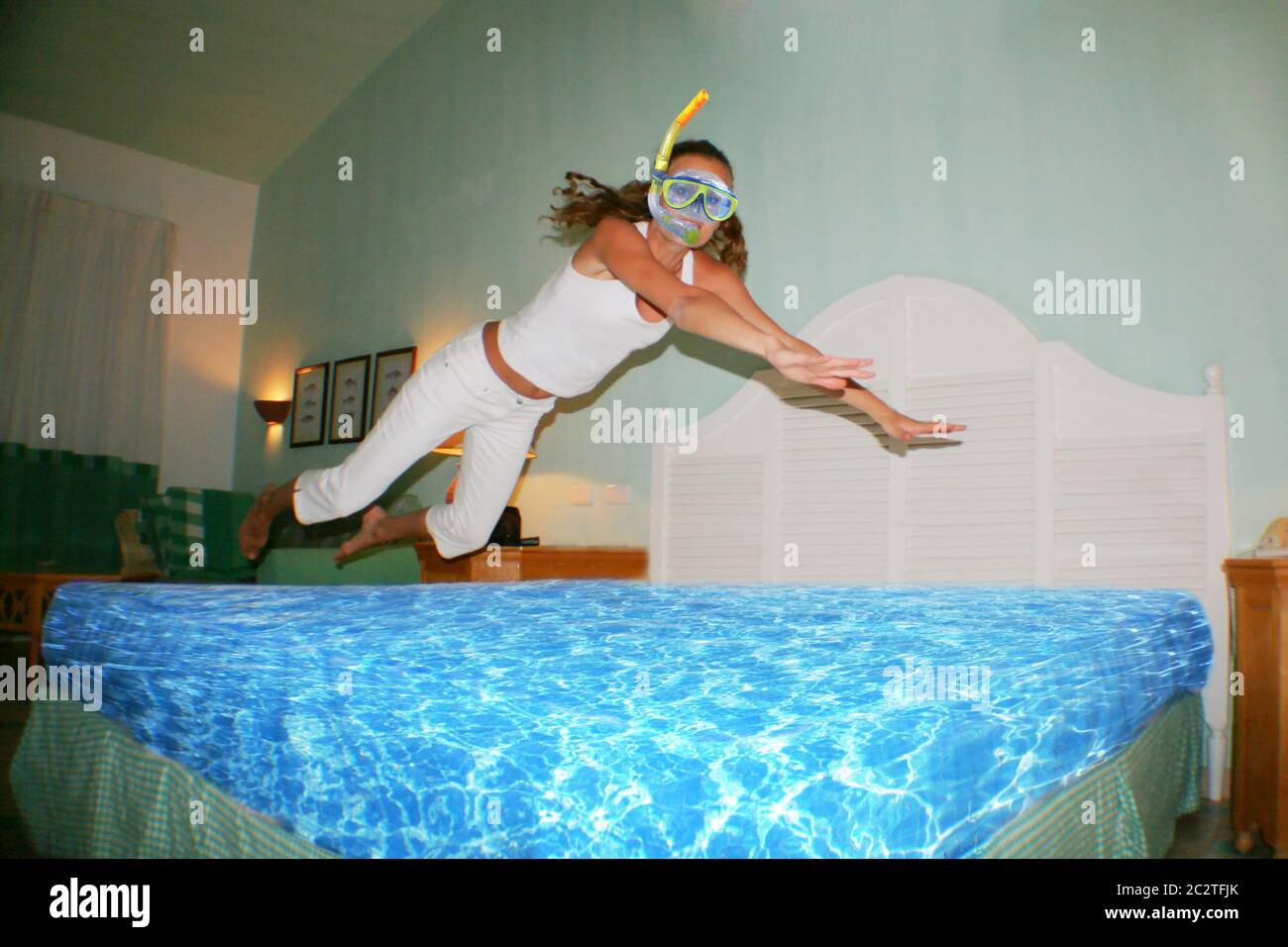 Snorkel woman jumping to bed Stock Photo - Alamy