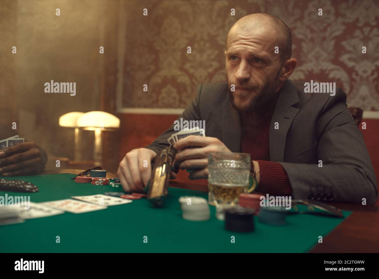 Man gun poker table hi-res stock photography and images - Alamy