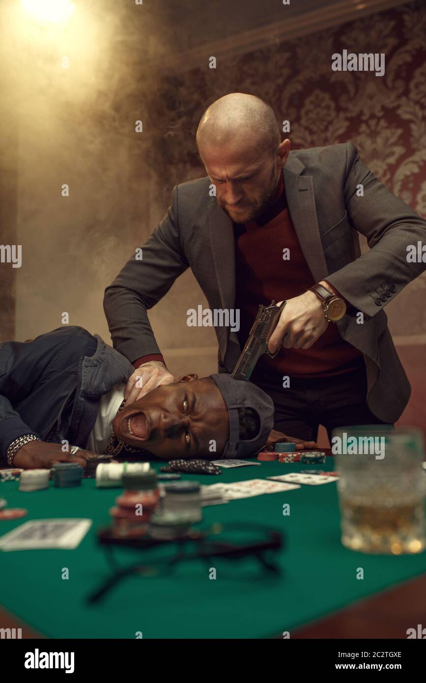 Man gun poker table in hi-res stock photography and images - Alamy