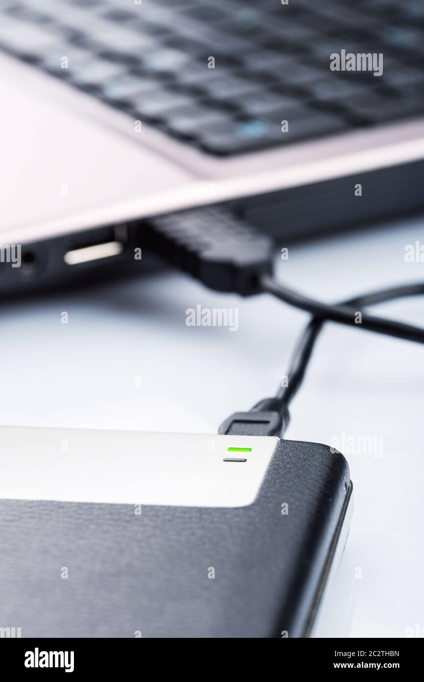 Closeup of external storage drive connecting with computer Stock Photo ...
