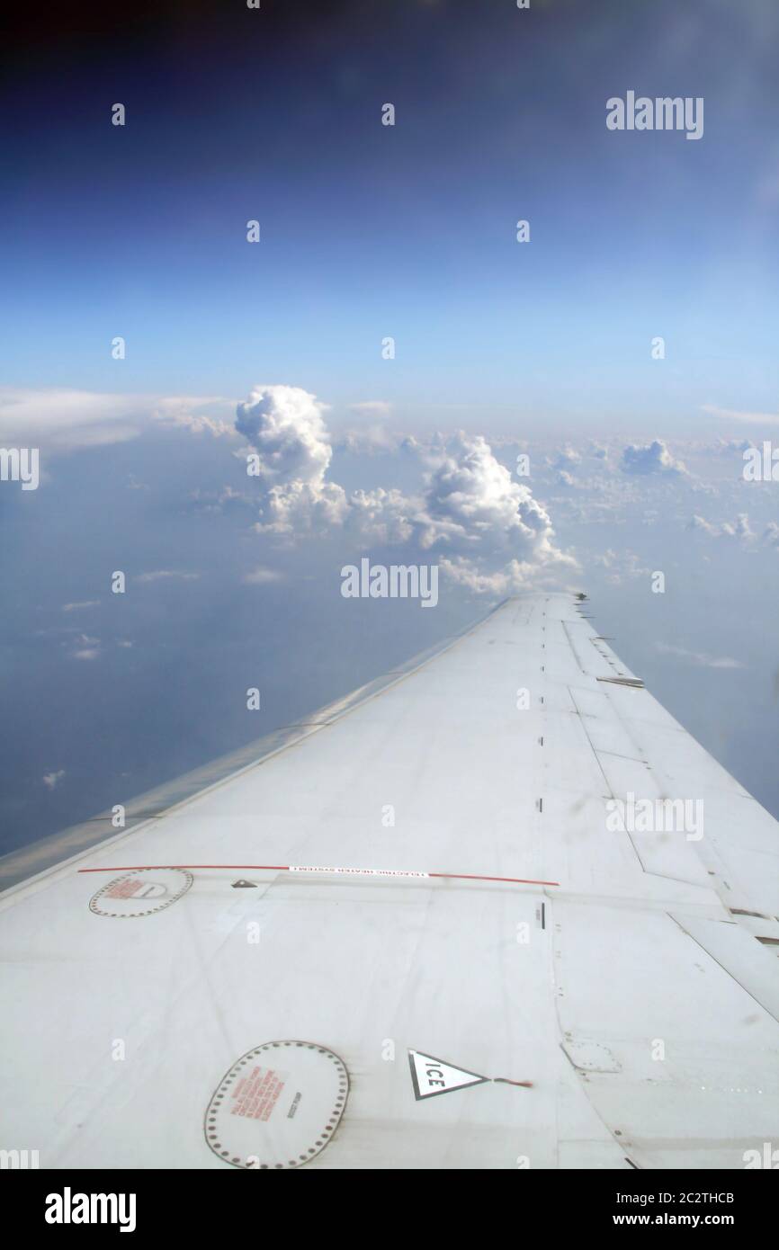 View of long airplane wing from window Stock Photo - Alamy