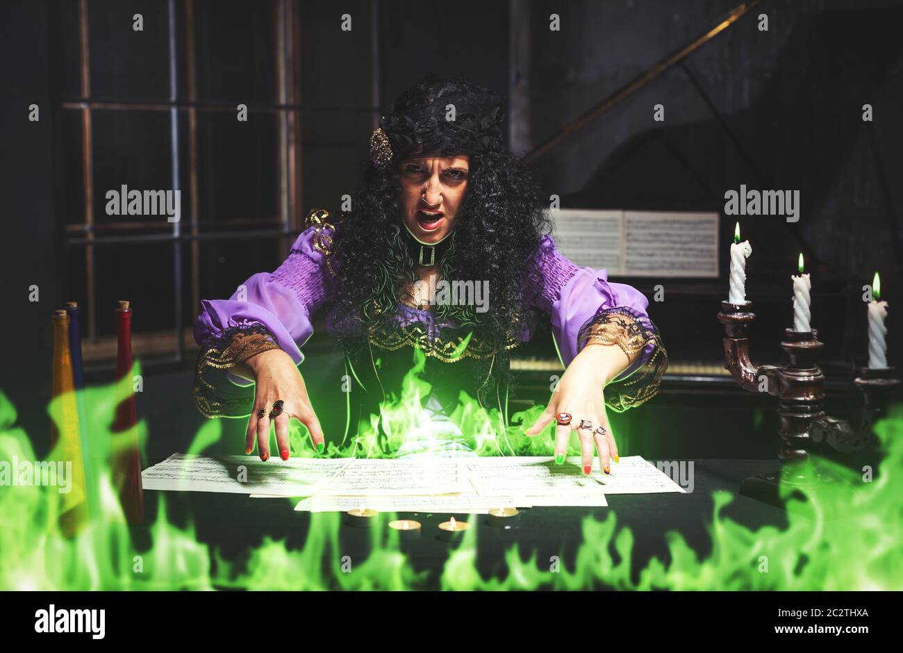 Sorceress practises witchcraft, she is summoning ghosts Stock Photo - Alamy