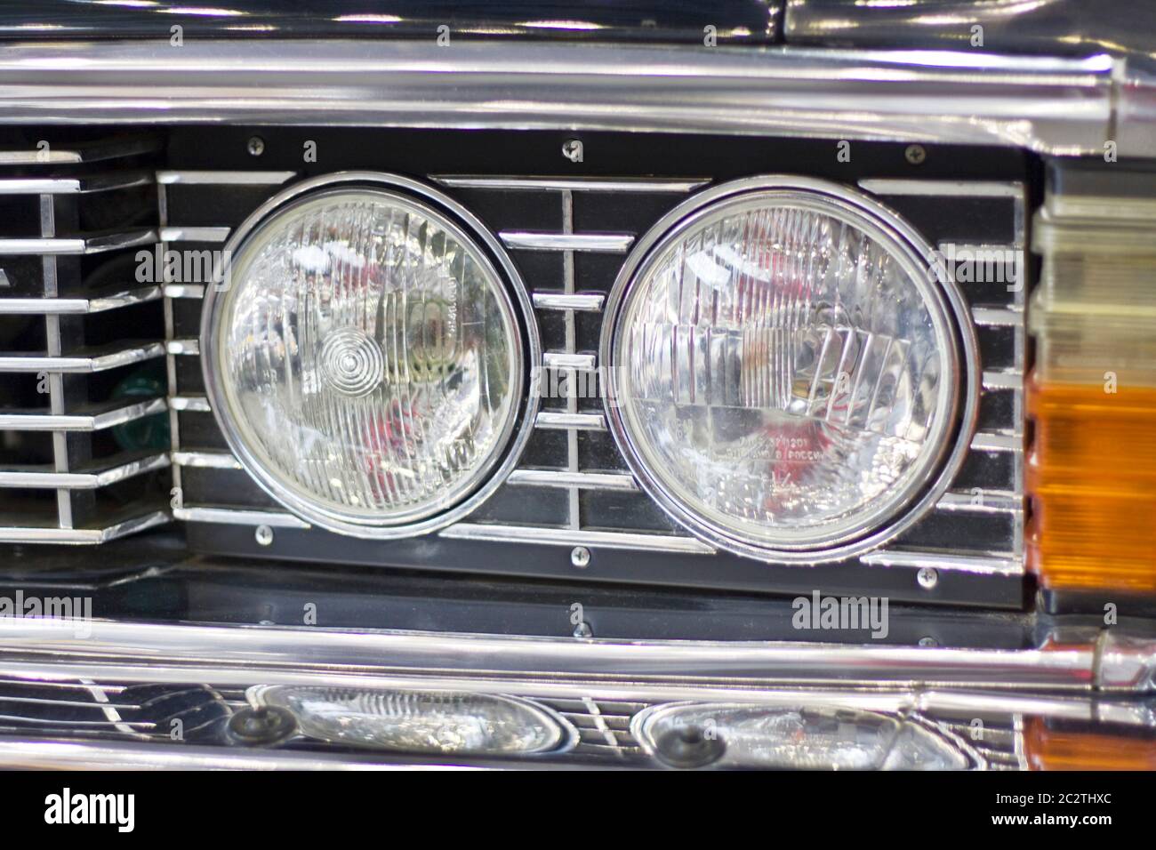 Retro car double headlight Stock Photo - Alamy