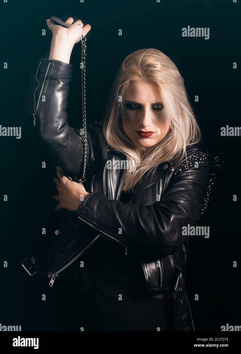 Dangerous looking blonde female with a chain Stock Photo - Alamy