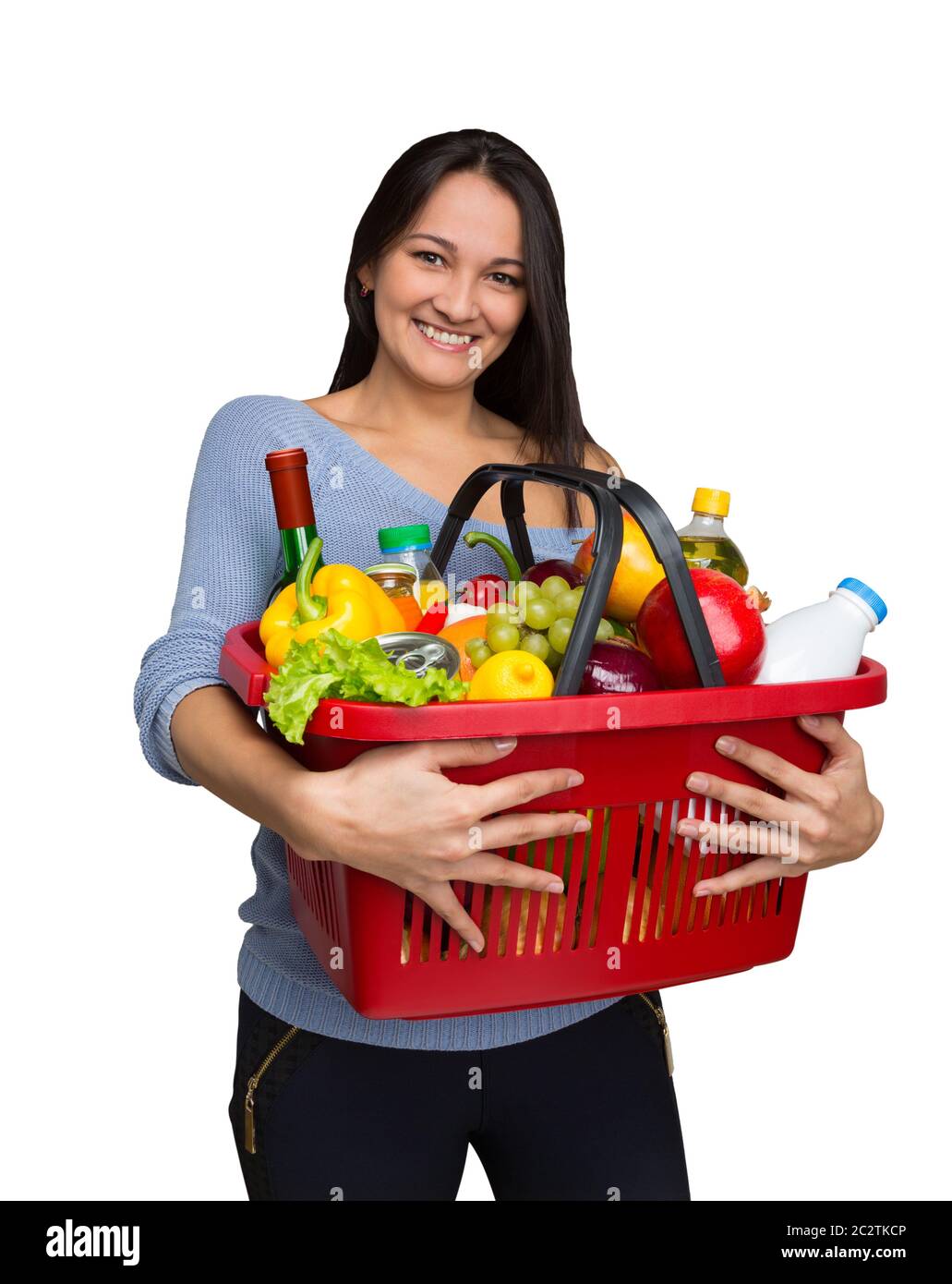 Young girl with a basket full of goods Stock Photo - Alamy