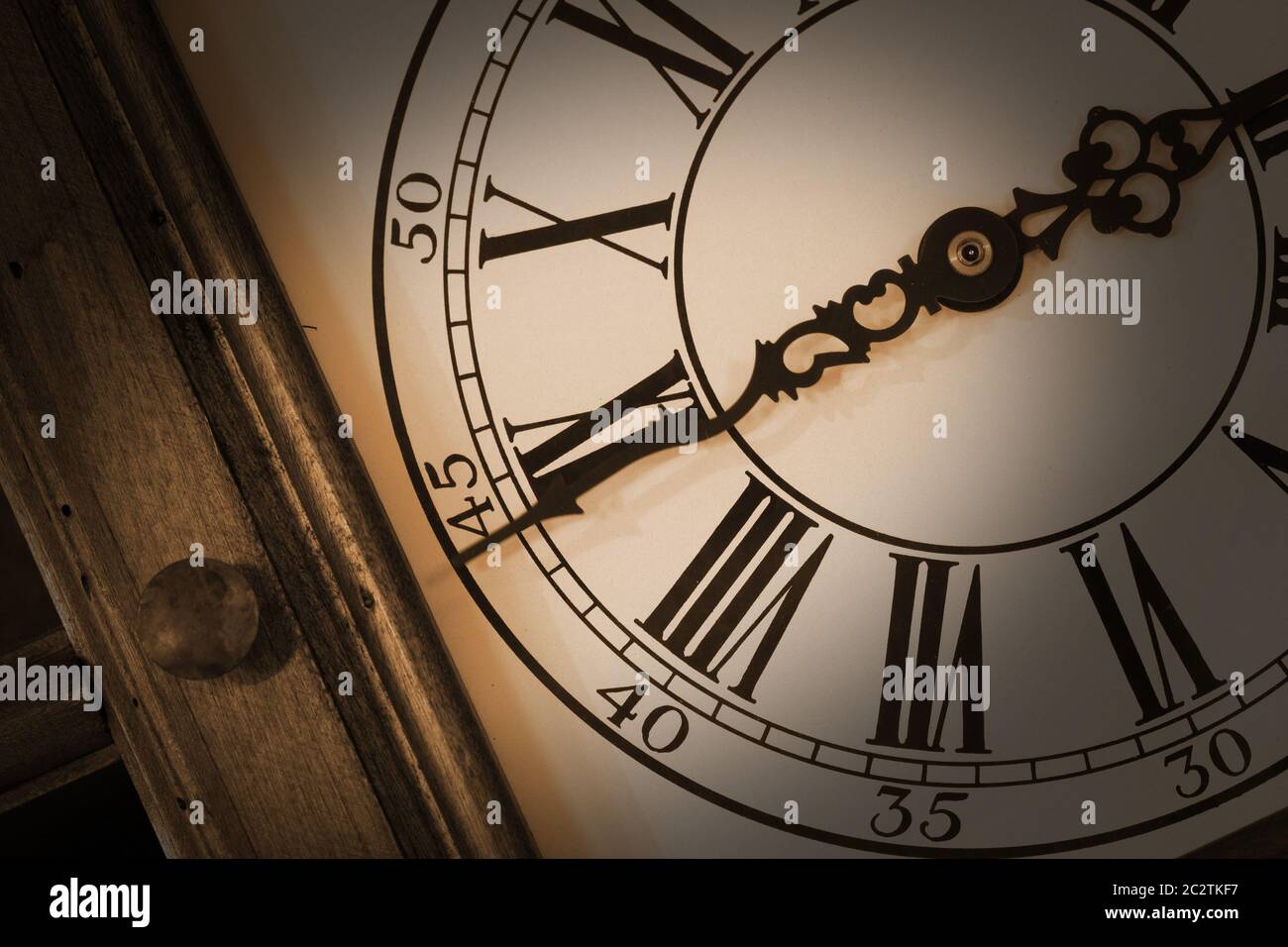 Close-up of antique wall clock. Sepia toned Stock Photo - Alamy