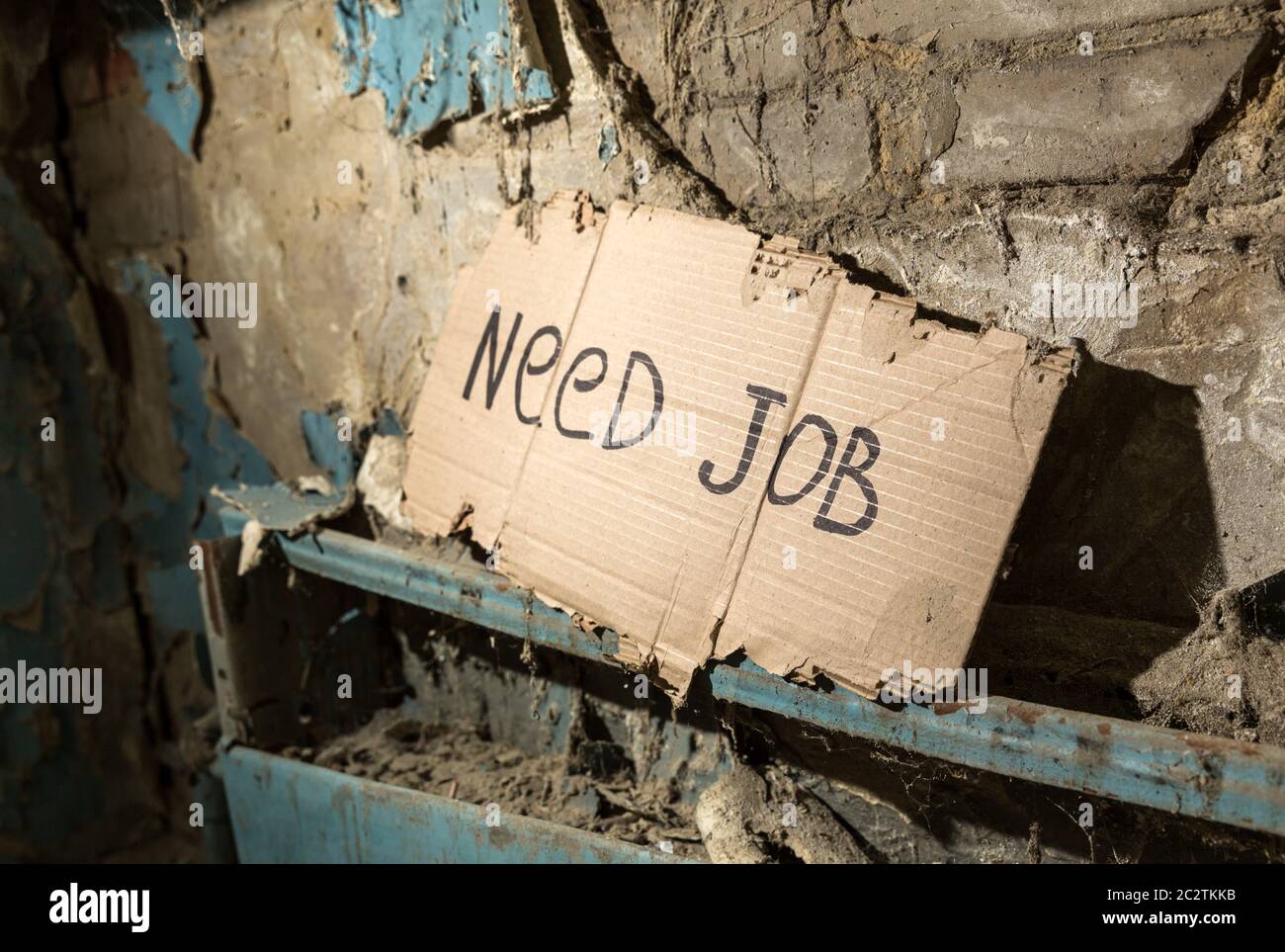 Need job. Brown cardboard torn in old house Stock Photo - Alamy