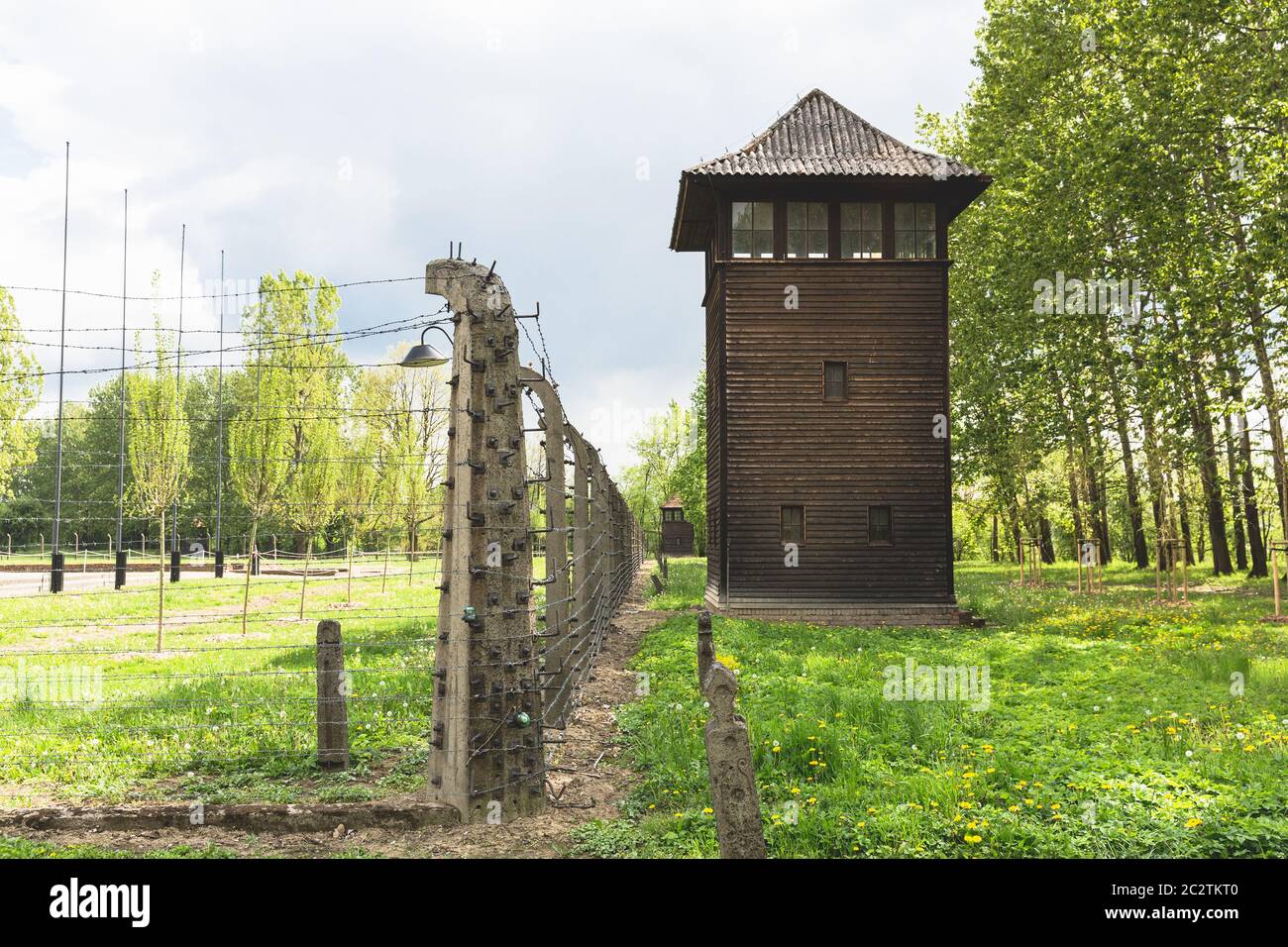 Watchtower and barbed wire fence on territory of German concentration ...