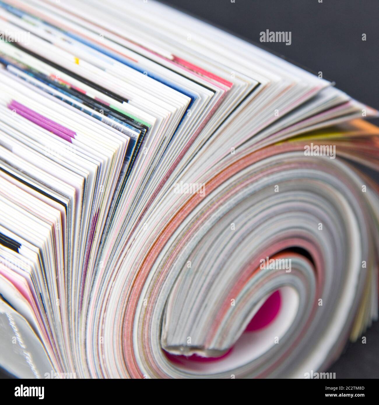Rolled up magazine Stock Photo - Alamy