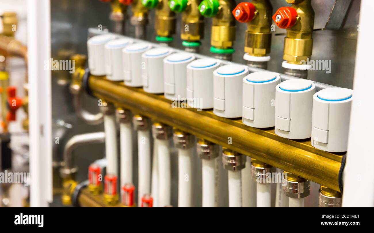 View of heating floor system collector Stock Photo - Alamy