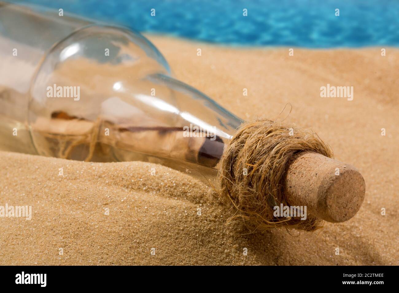 Message in a bottle on the beach Stock Photo - Alamy