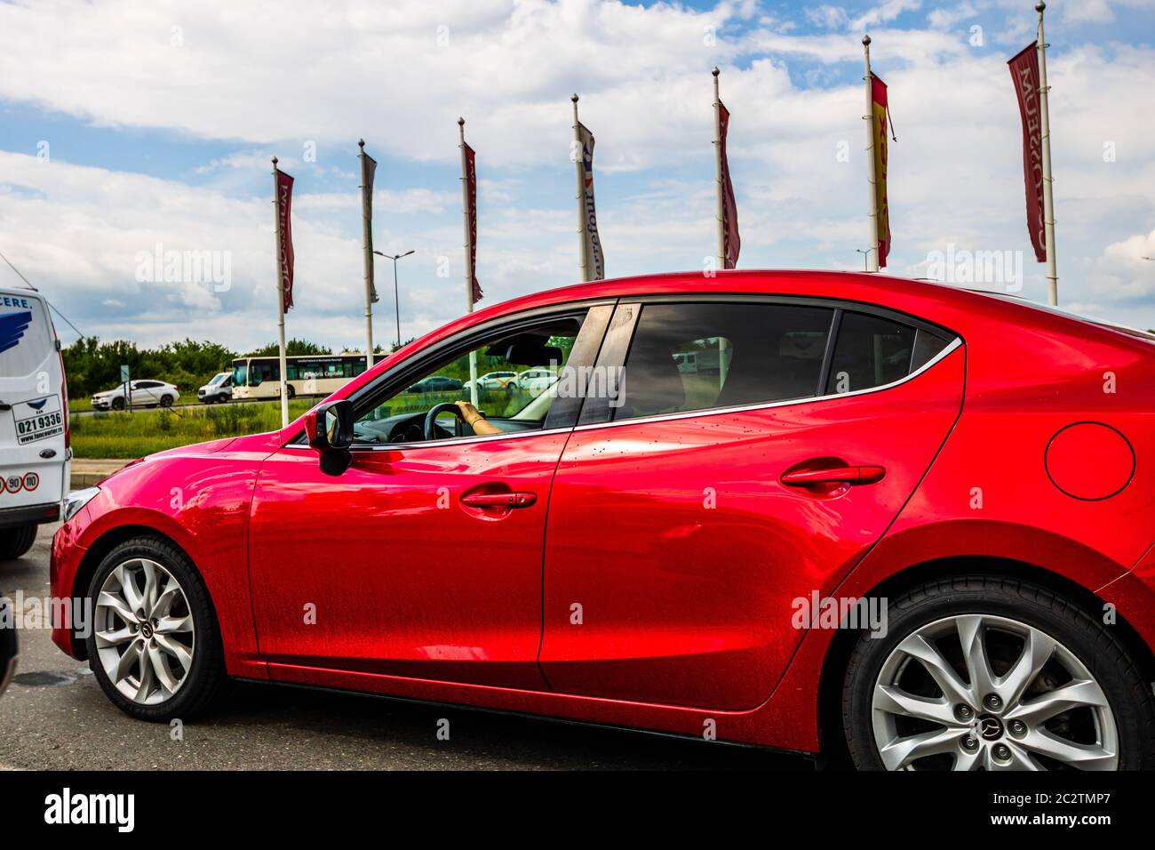 Traffic with road view through car front window, Red mazda 3 car in ...