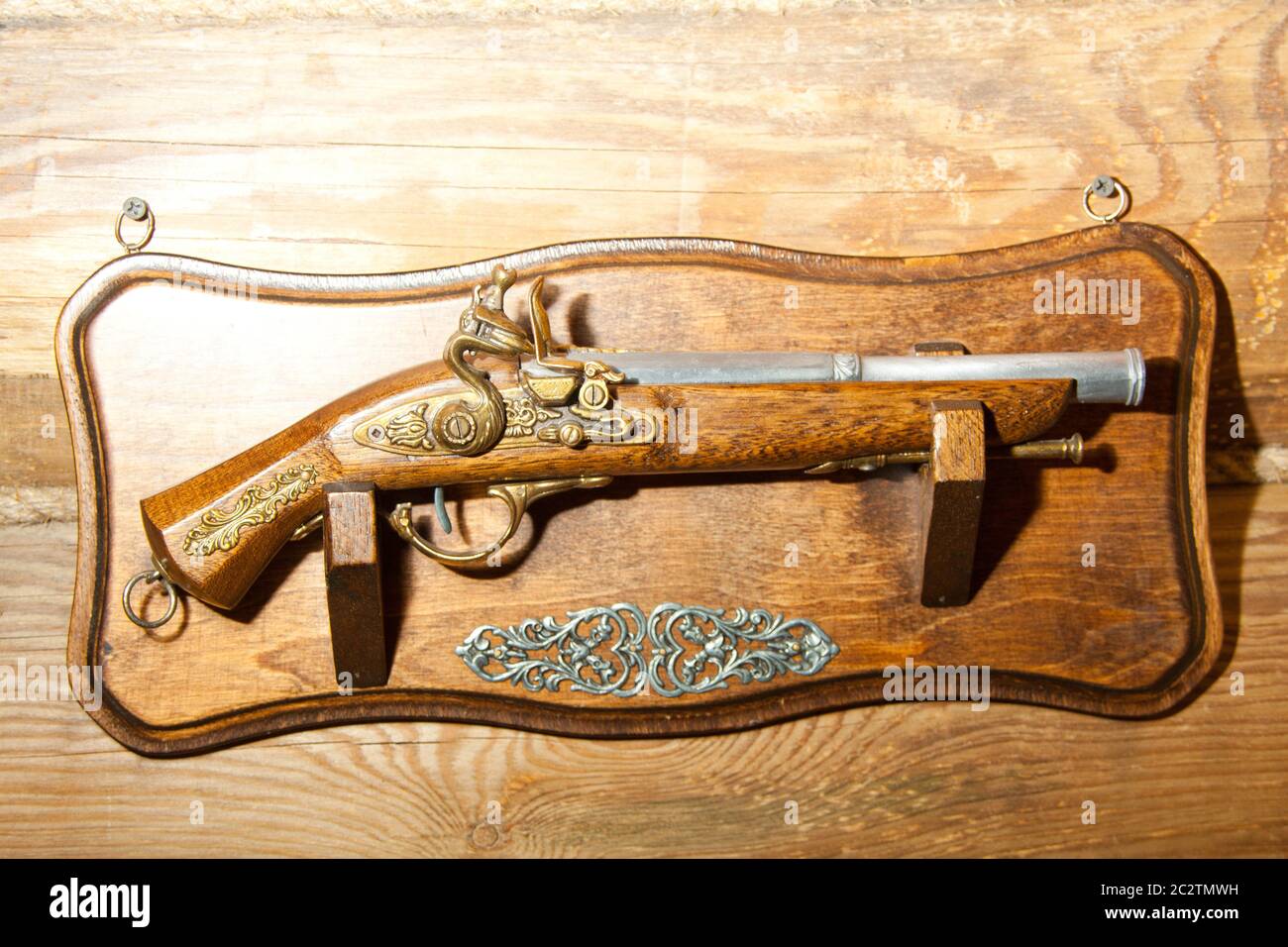 Retro wooden pistol on wood surface Stock Photo - Alamy