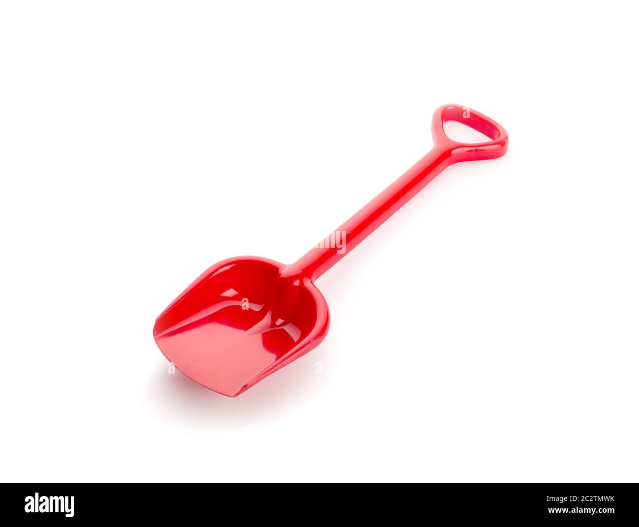 Red plastic toy shovel isolated on a white background Stock Photo - Alamy