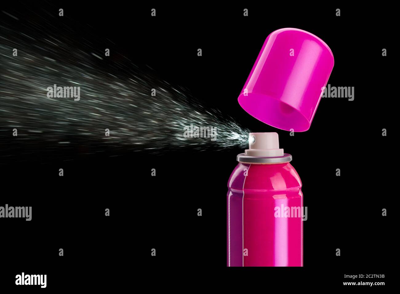 Pink spray aerosol over black Stock Photo - Alamy