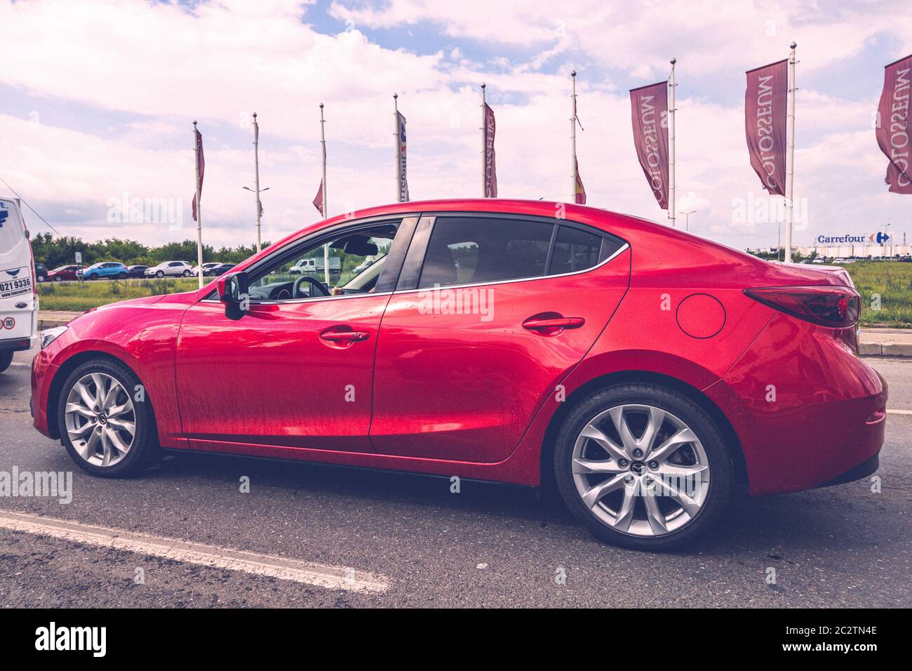 Traffic with road view through car front window, Red mazda 3 car in ...