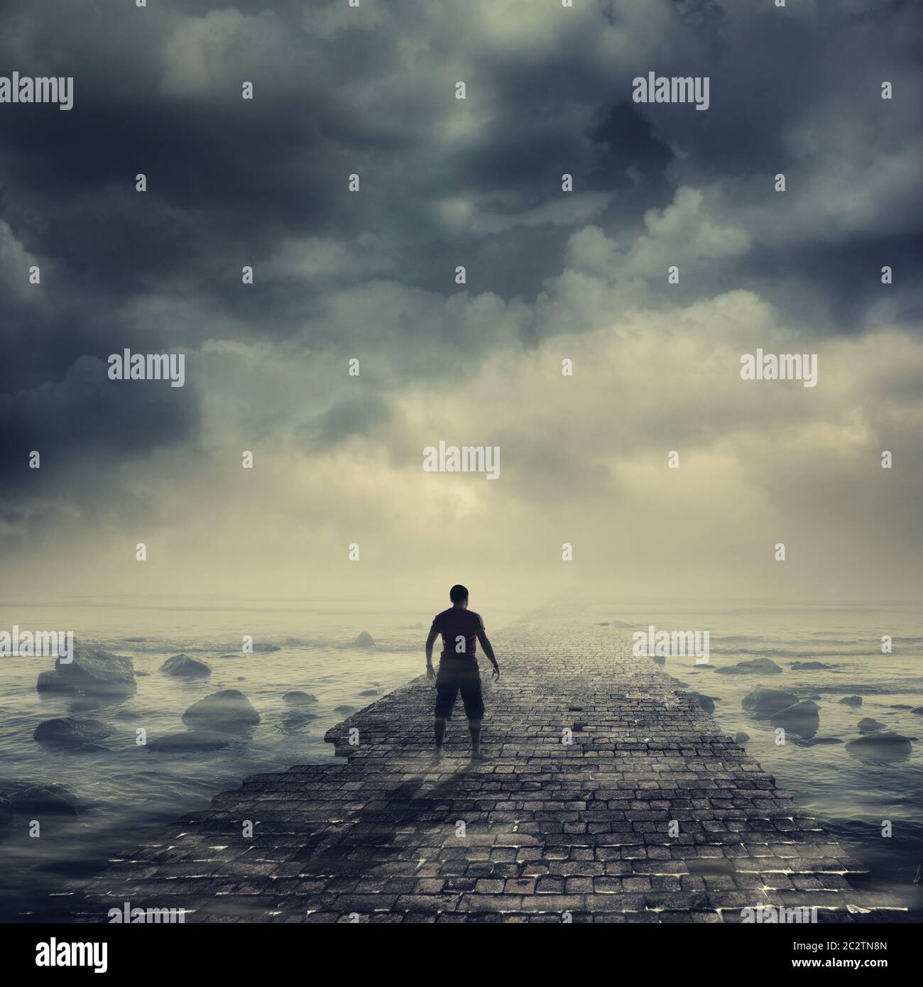Silhouette of man walks on long way to the light Stock Photo - Alamy