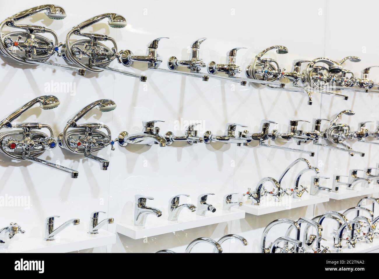 Show-bench with modern bath mixers and taps Stock Photo - Alamy