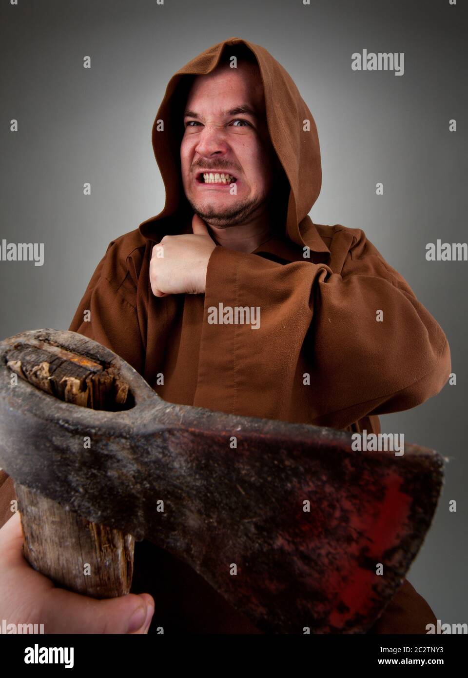 Furious medieval executioner with big bloody axe Stock Photo - Alamy