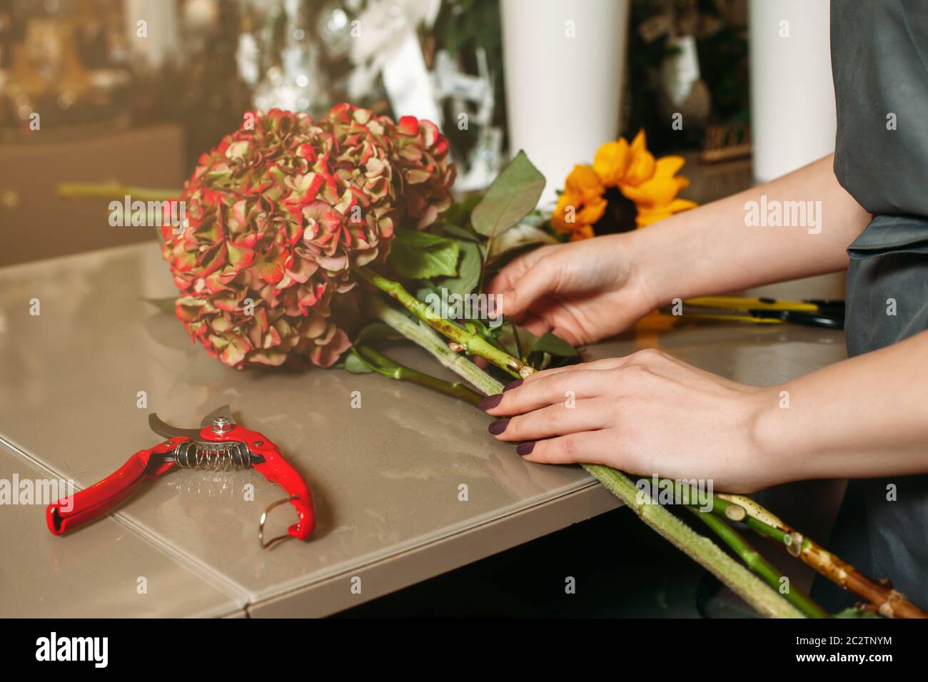 Flower bouquet creation. Florist work at flower shop Stock Photo - Alamy