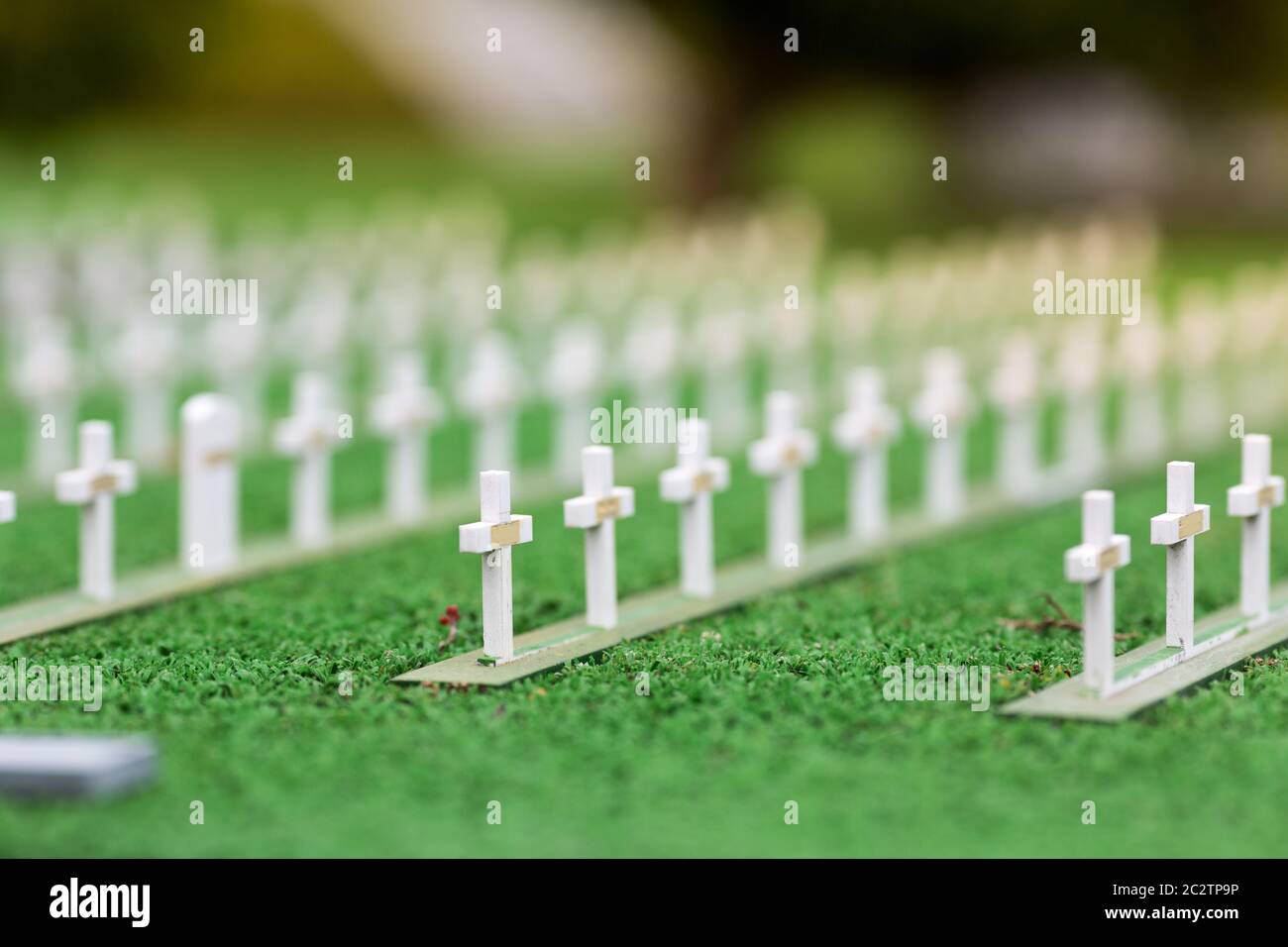 Cemetery, grave crosses and green grass, miniature scene outdoor ...
